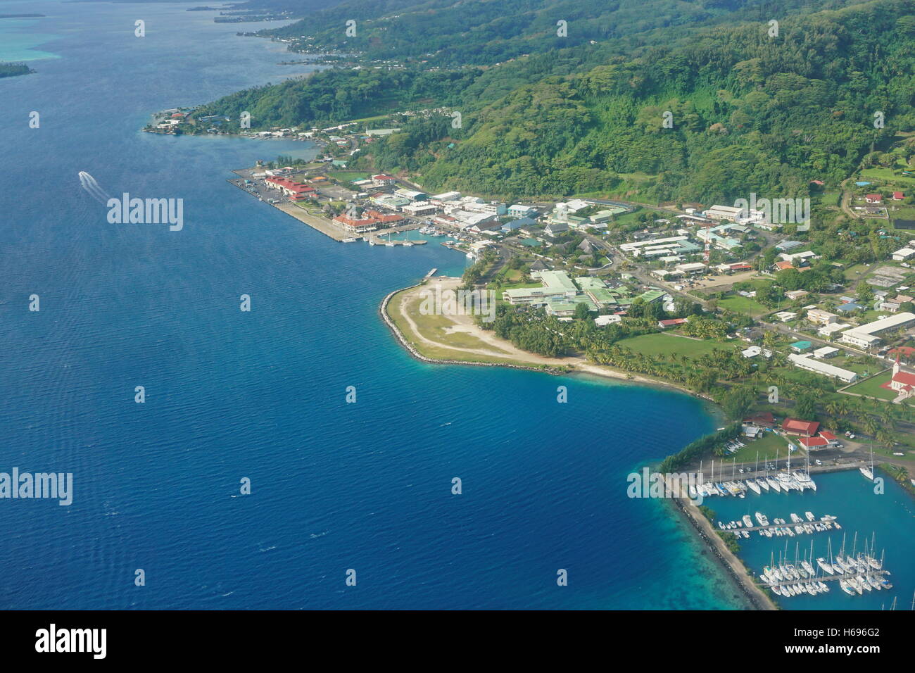 Aerial view of coastal town of Uturoa in Raiatea island, south Pacific ...