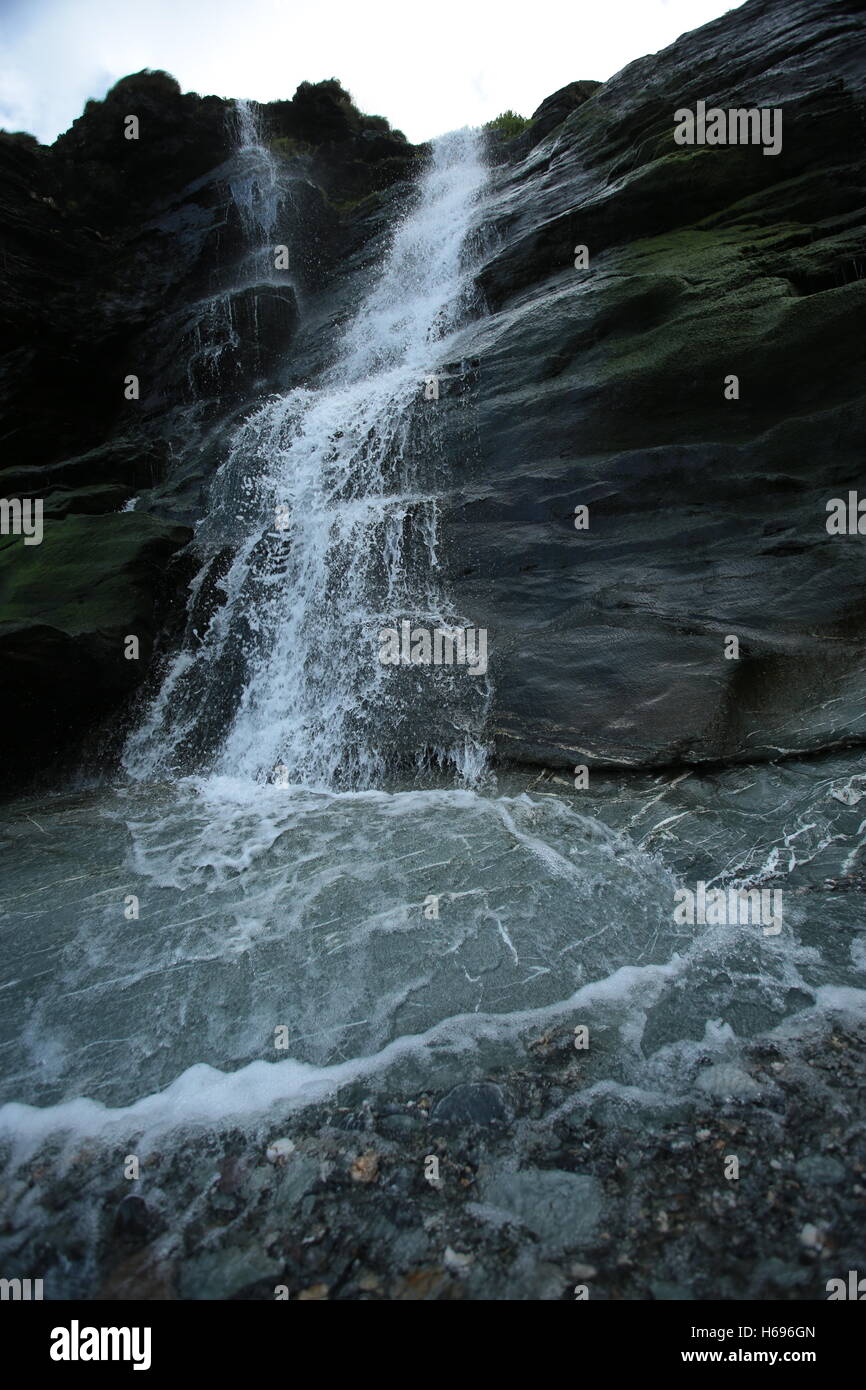 A waterfall on a beach Stock Photo - Alamy