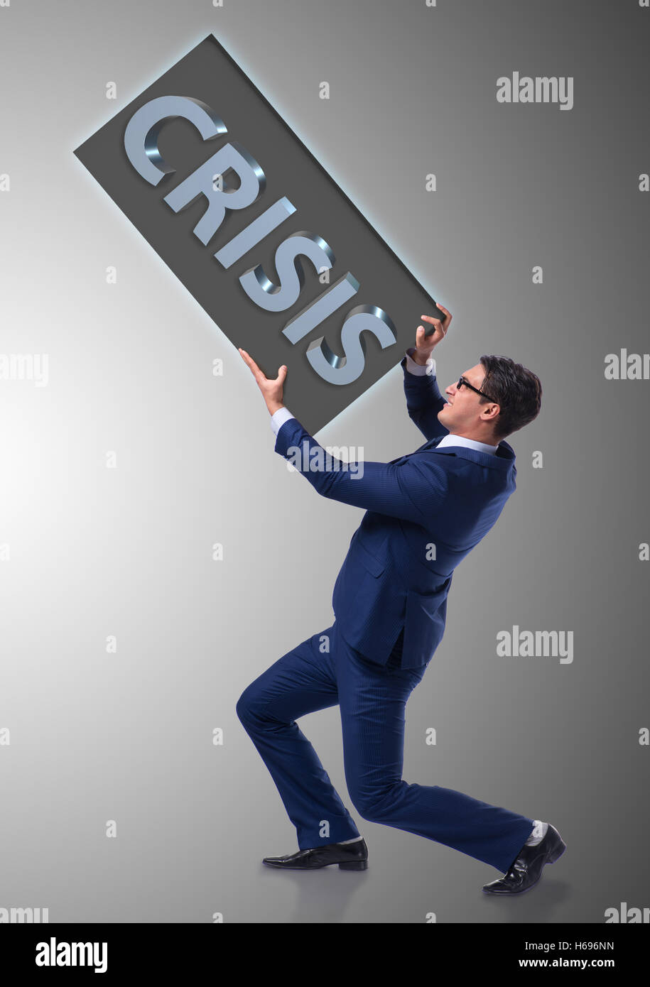 Man struggling with crisis in business concept Stock Photo - Alamy