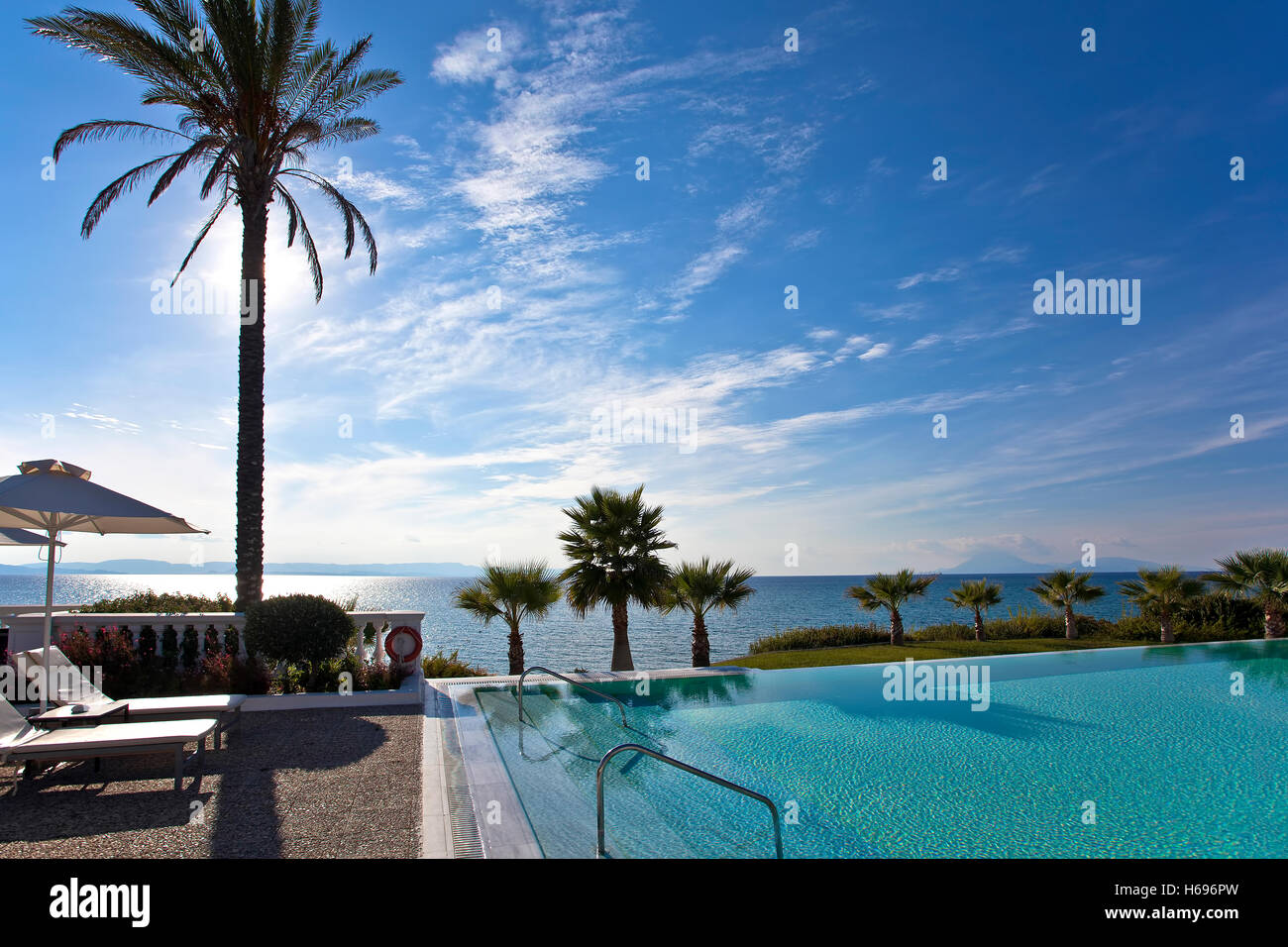 Luxury hotel pool at sunset Stock Photo - Alamy