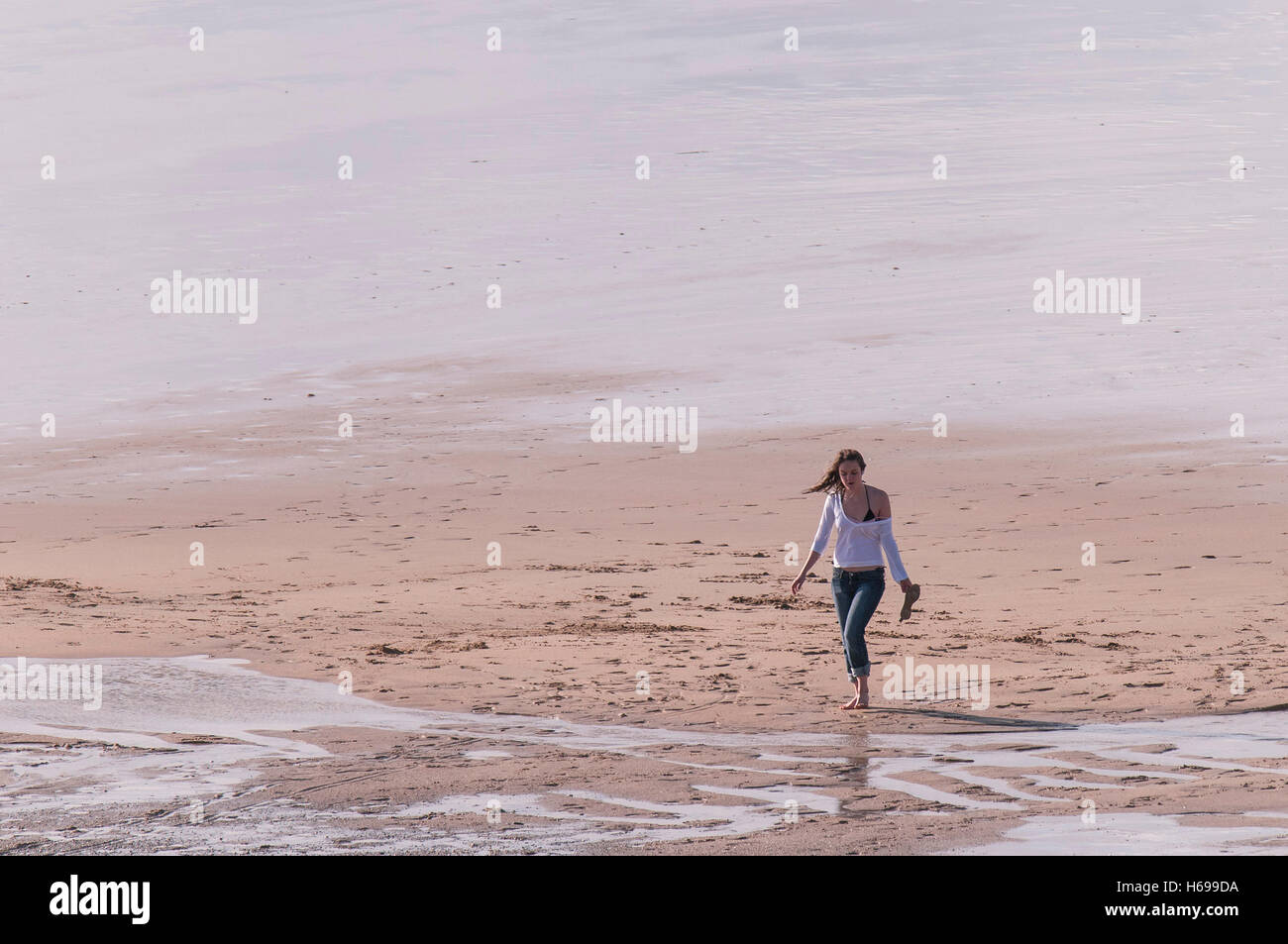 Woman walks alone along hi-res stock photography and images - Alamy