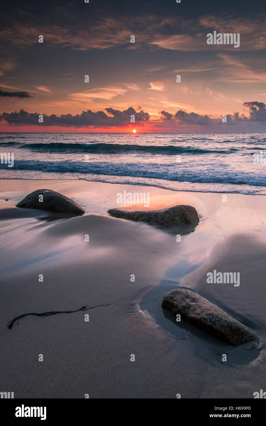 Sunset over Sennen Beach in Cornwall Stock Photo - Alamy