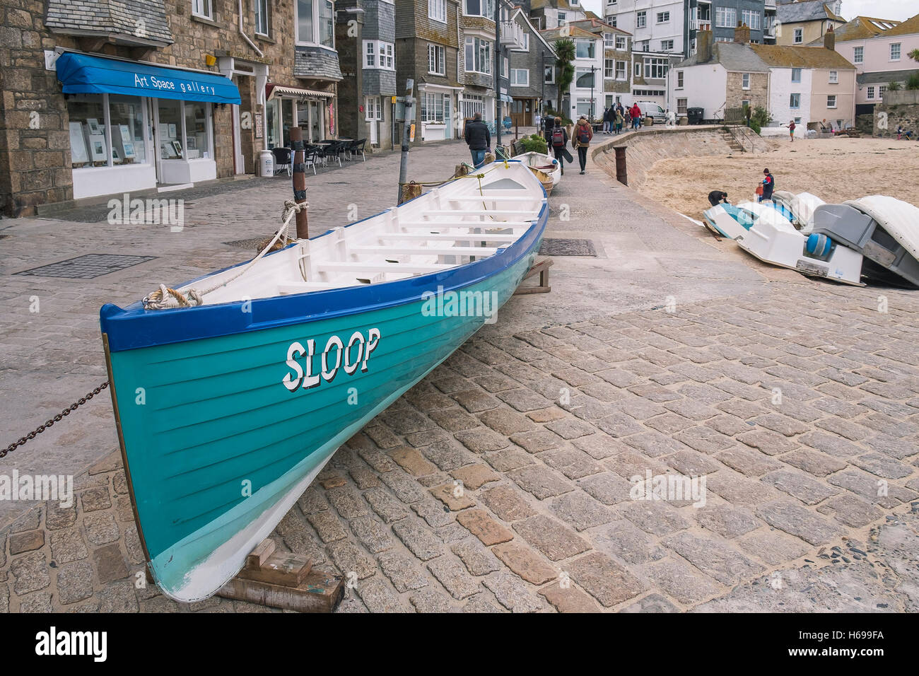 The St Ives Pilot Gig Sloop on the quayside in Cornwall Stock Photo - Alamy