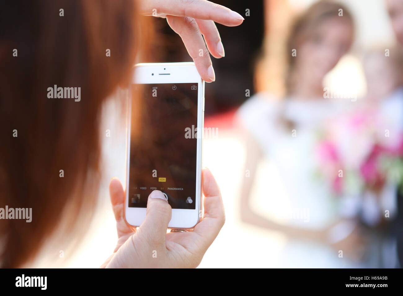 woman taking photo with mobile cell phone wedding Stock Photo - Alamy