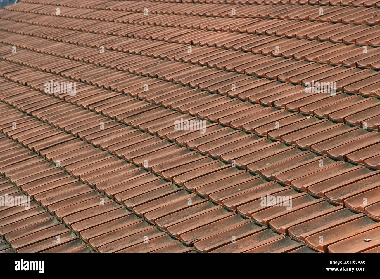 Red ceramic roof tiles. Roof tiles Stock Photo - Alamy