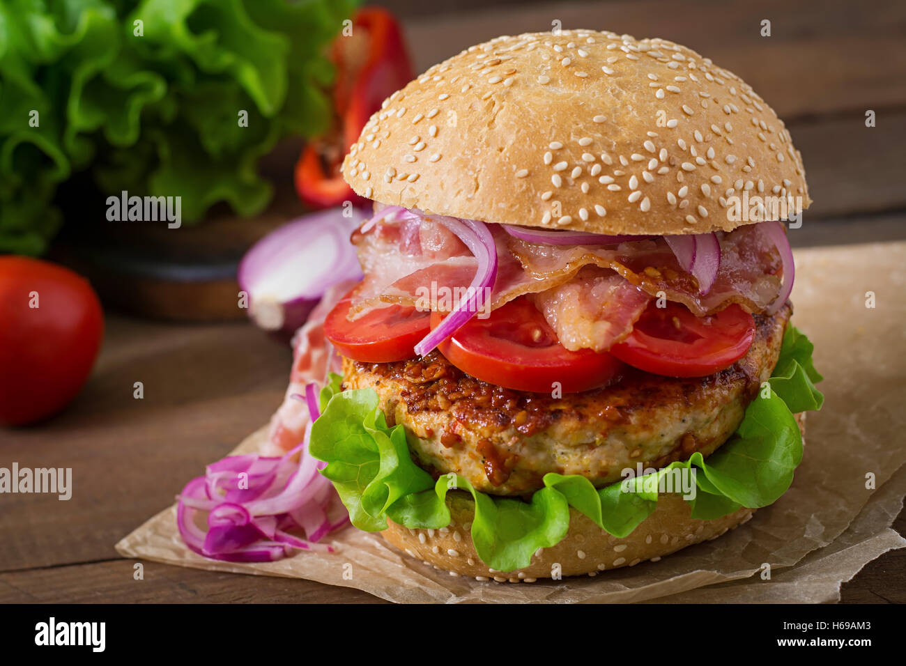 Big sandwich - hamburger burger with beef, red onion, tomato and fried ...