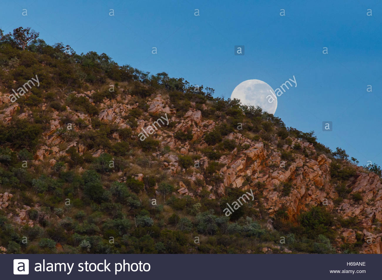 A full moon on the horizon near Talbot Bay in the Kimberley Region of ...