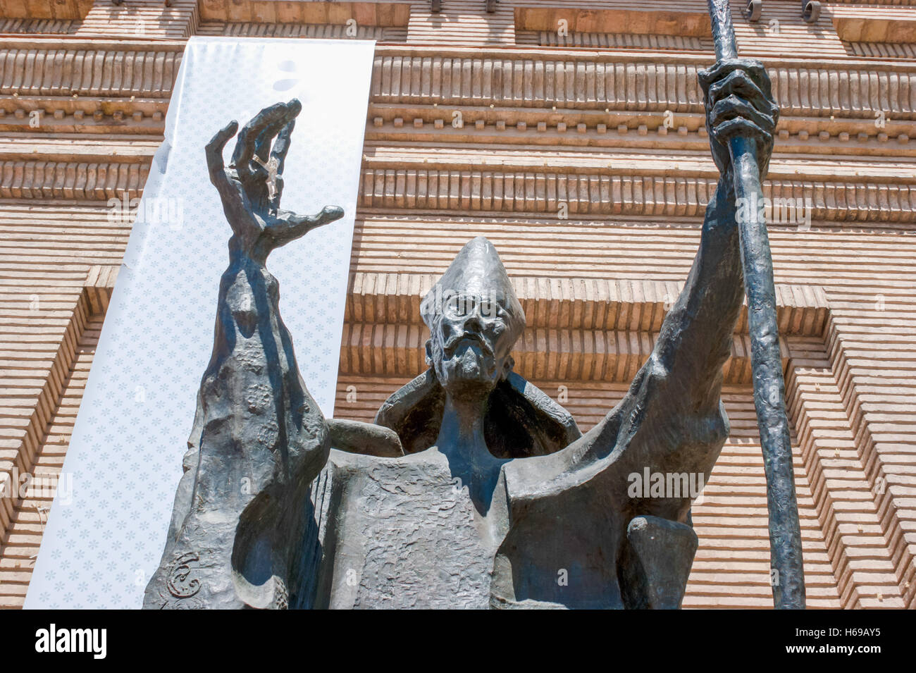 the modern statue of the priest blesses everyone who come to city hall ...
