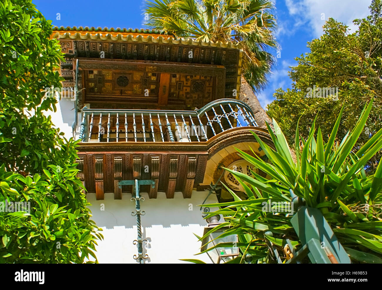The medieval wooden balcony with forged metal railings and hand painted ...