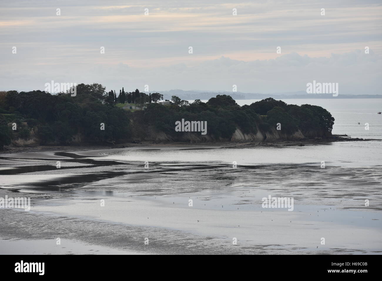 Shallow bay at low tide with vast sand beds in low light Stock Photo ...