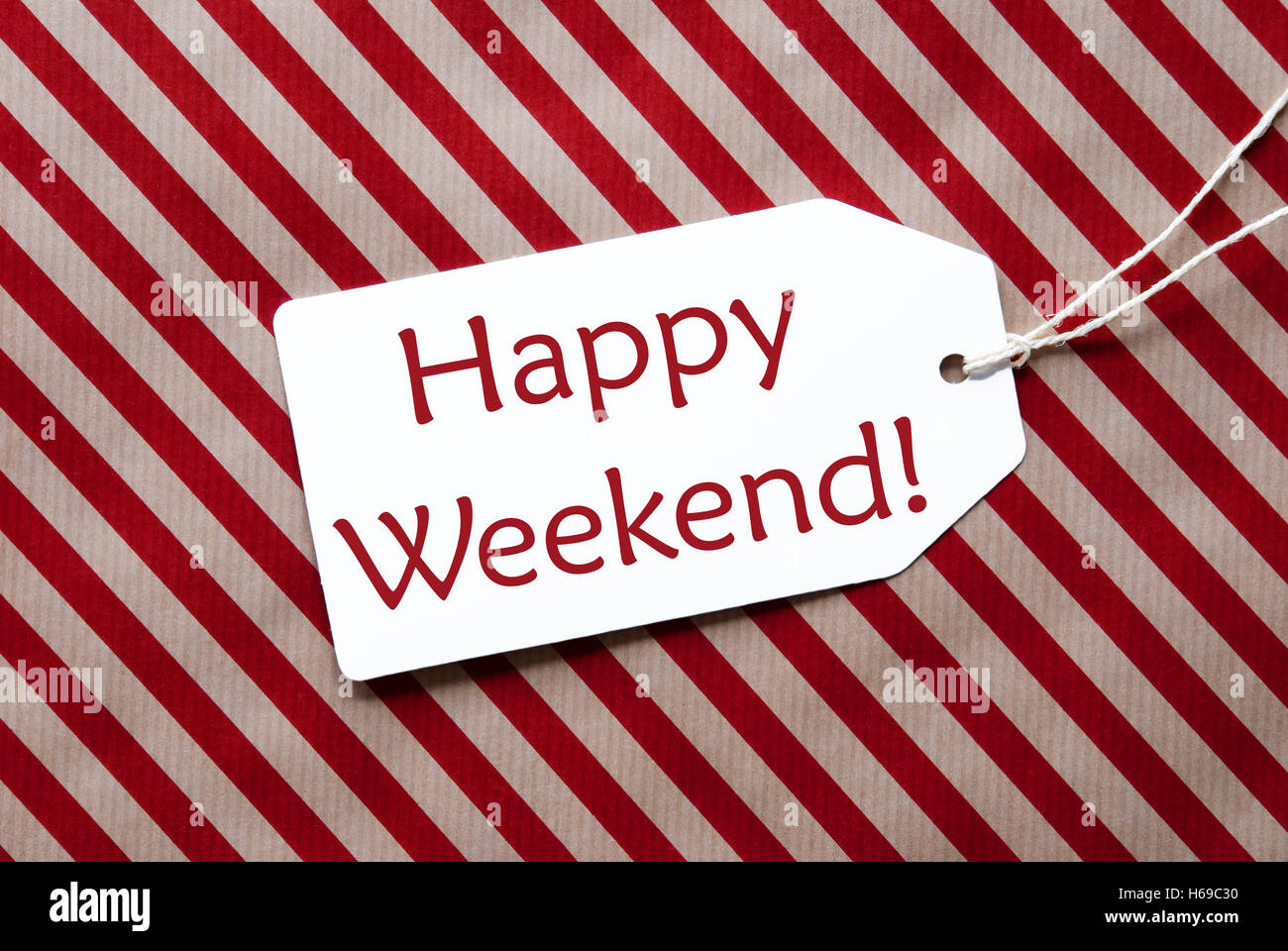 Label On Red Wrapping Paper, Text Happy Weekend Stock Photo - Alamy