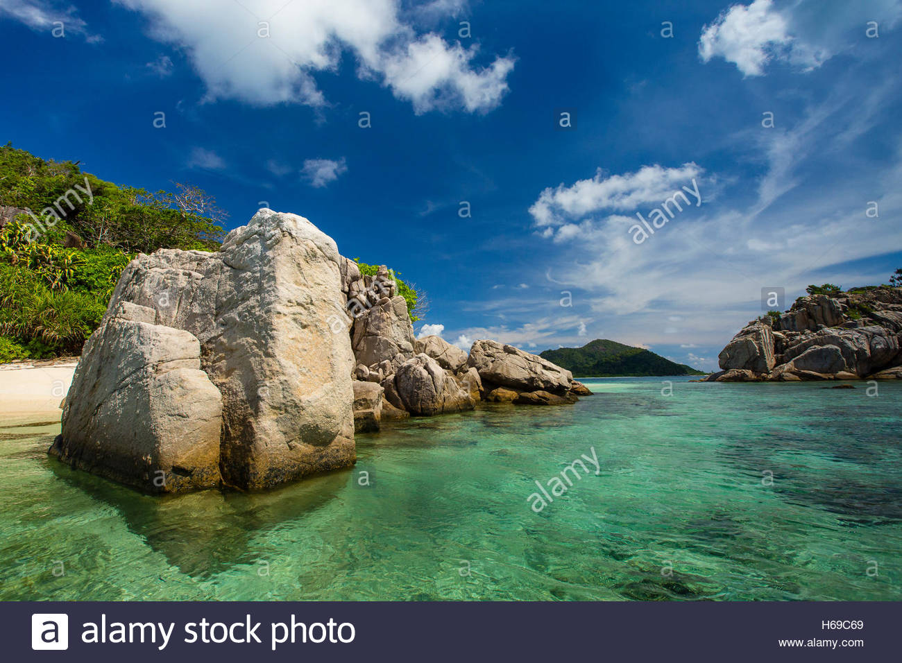 Granite rock formations define a tropical beach Stock Photo - Alamy