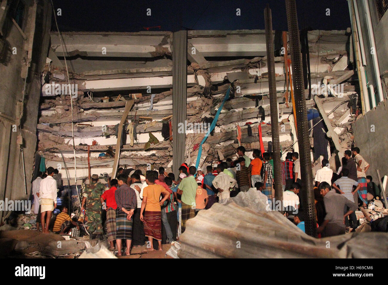 Rescue workers try to rescue trapped garment workers in the Rana Plaza building which collapsed ...