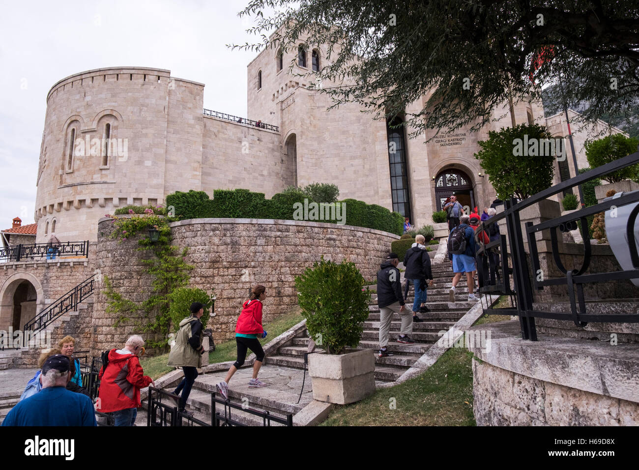 Tourists walking towards Skanderbeg Museum. Kruje Castle houses the ...