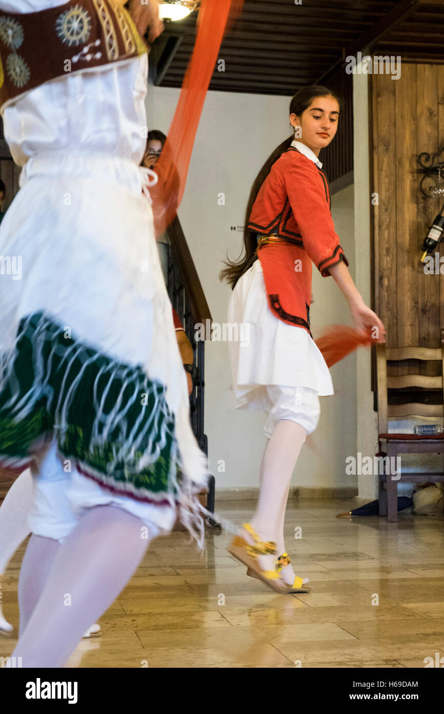 A group dressed in traditional costumes perform Albanian music and ...