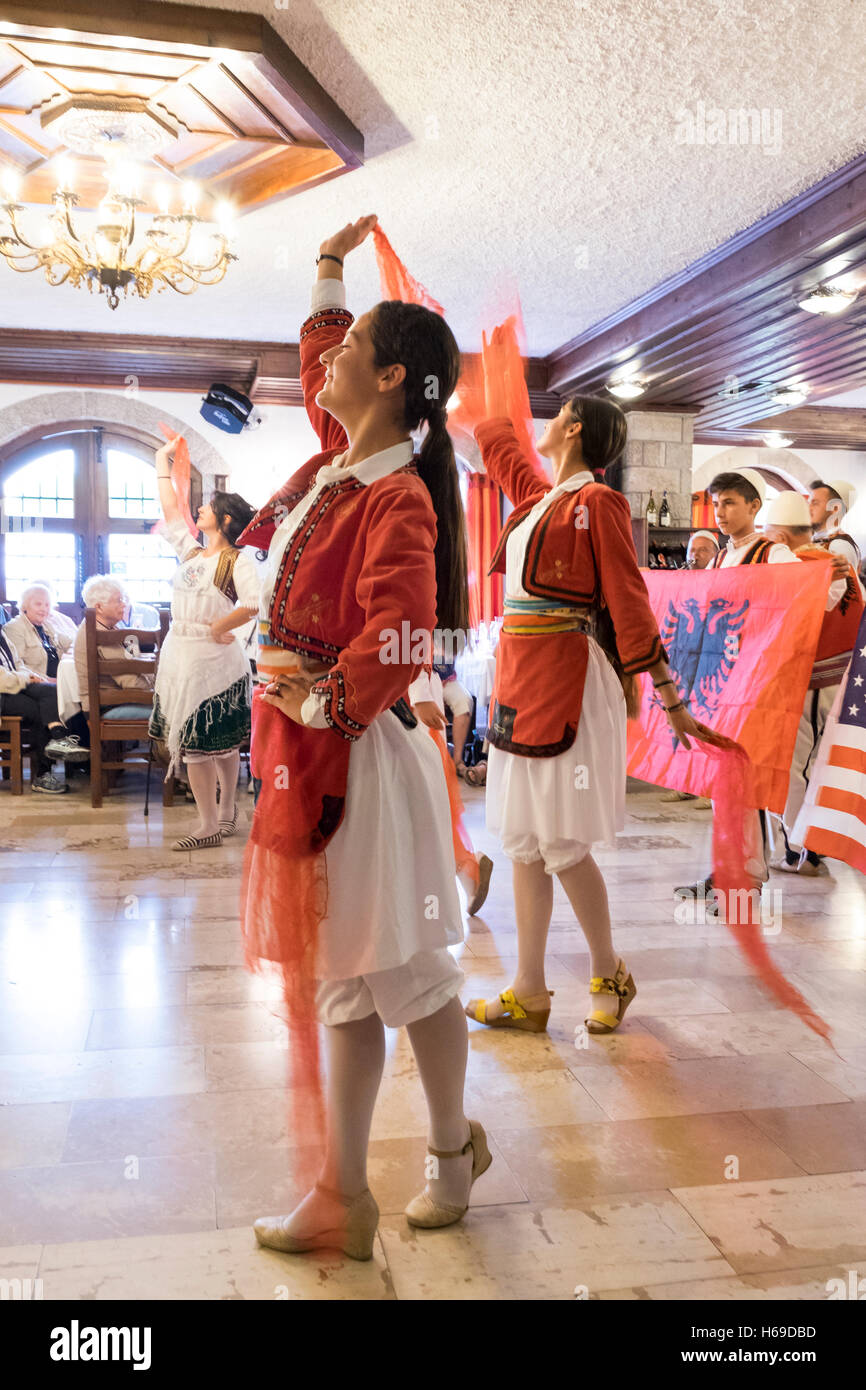 A group dressed in traditional costumes perform Albanian music and ...