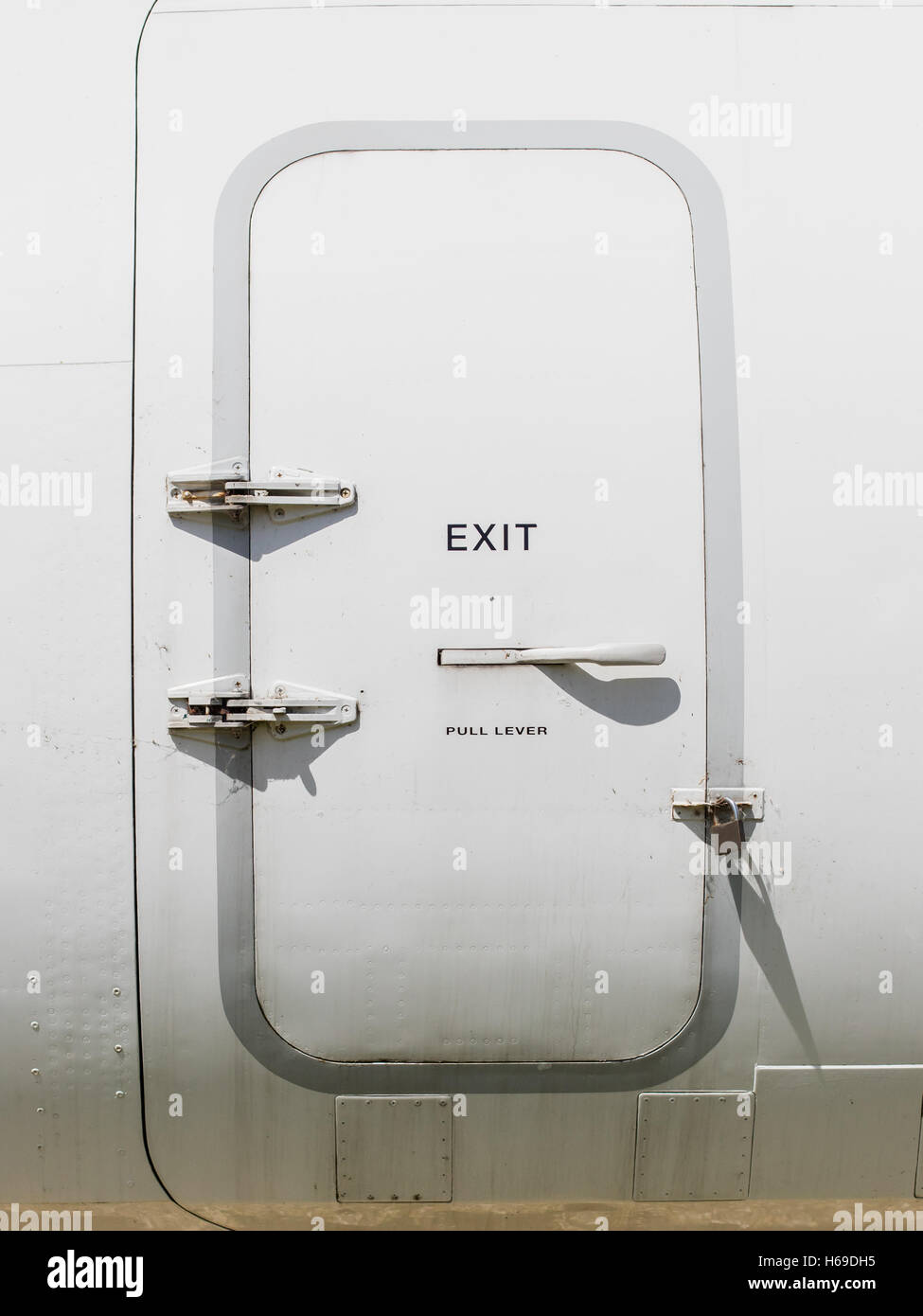Emergency exit door in an old airplane Stock Photo - Alamy