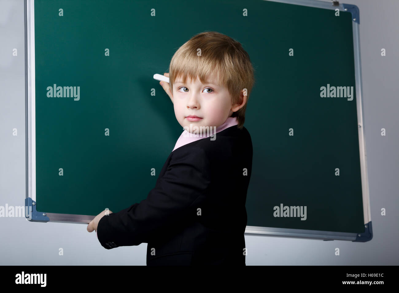 little funny boy with blackboard Stock Photo - Alamy
