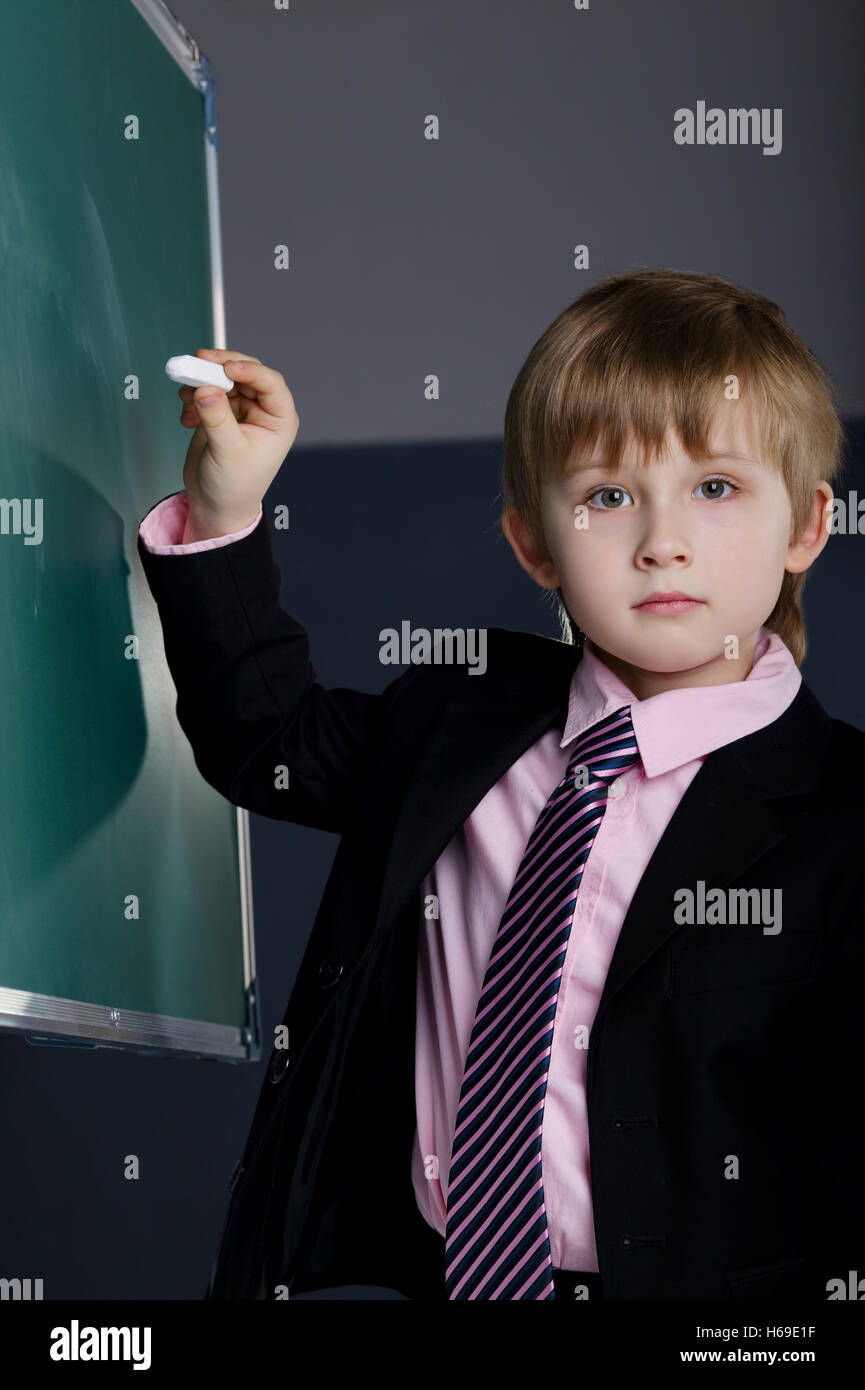 little funny boy with blackboard Stock Photo - Alamy
