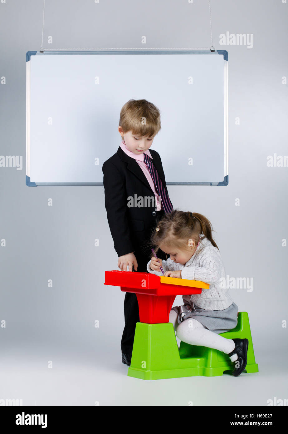 young boy teaching sister Stock Photo - Alamy
