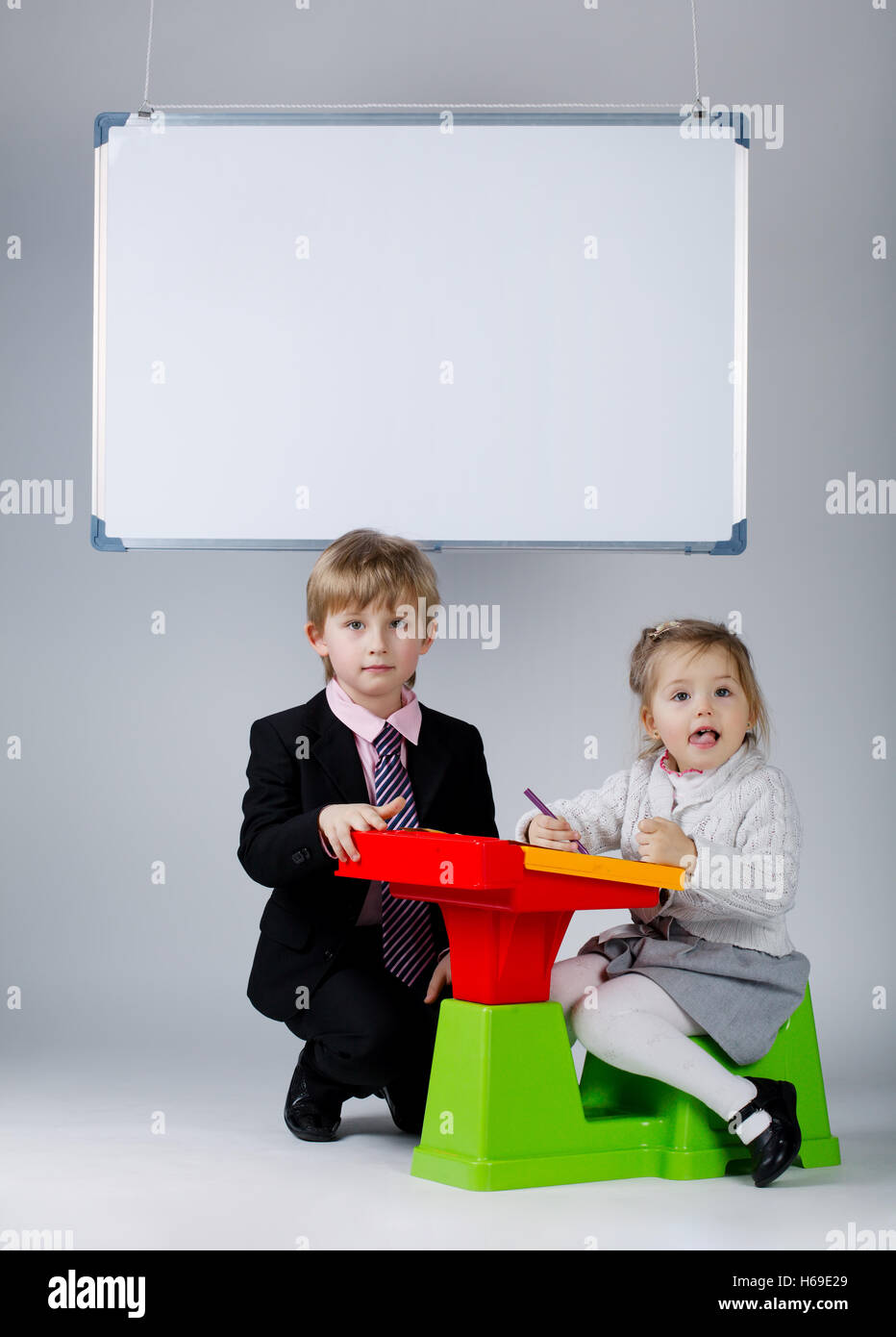 young boy teaching sister Stock Photo - Alamy