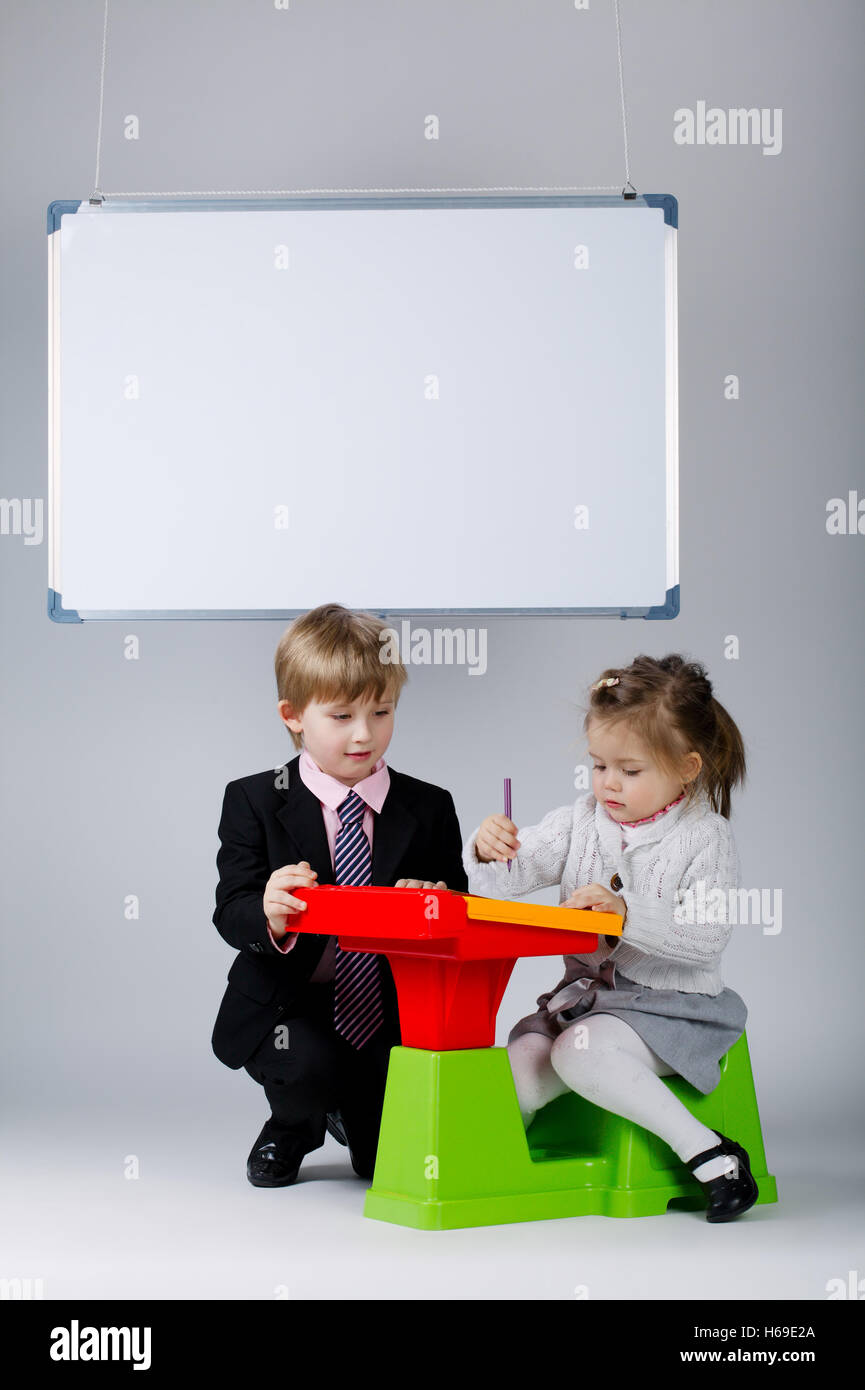 young boy teaching sister Stock Photo - Alamy