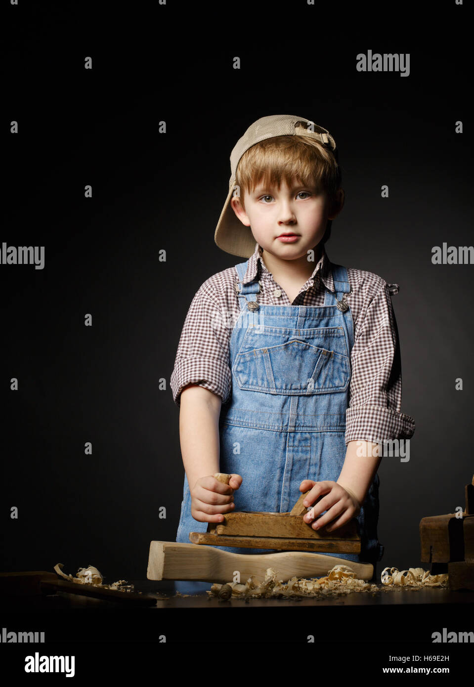 little boy working with plane Stock Photo - Alamy