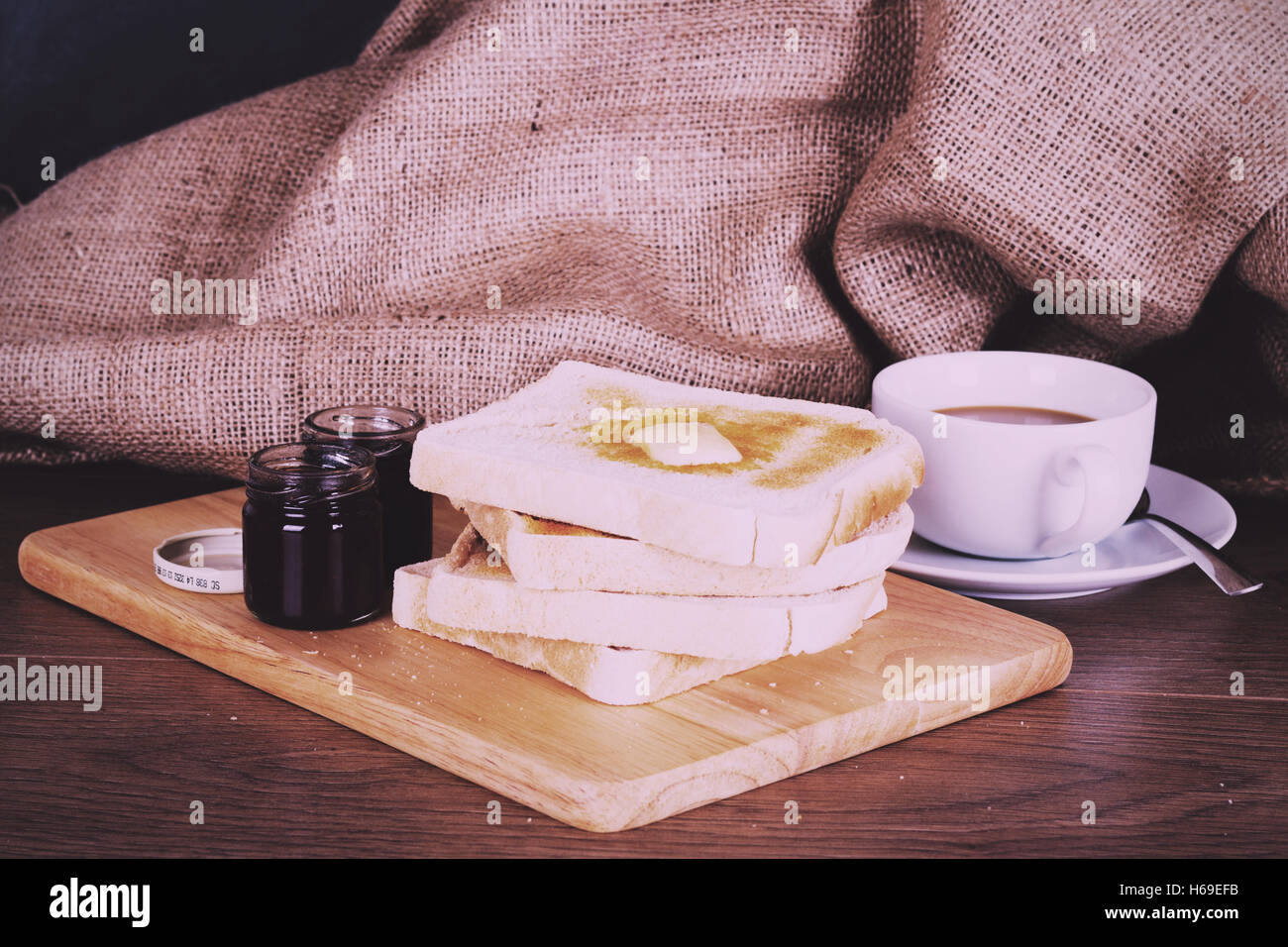 Slices of warm toast against a rustic wooden background Vintage Retro ...