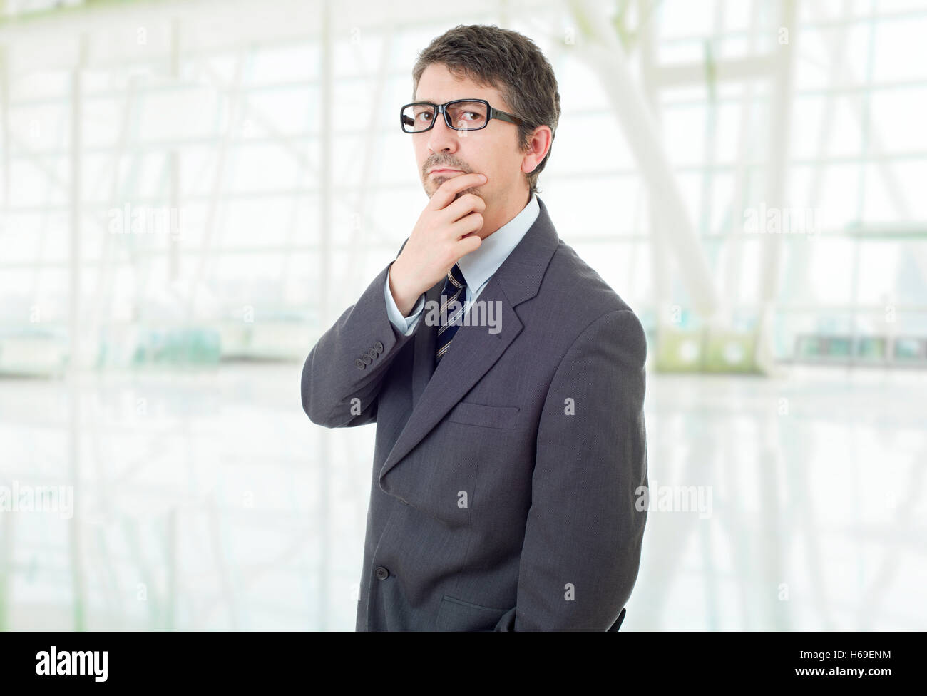 young business man thinking, at the office Stock Photo - Alamy