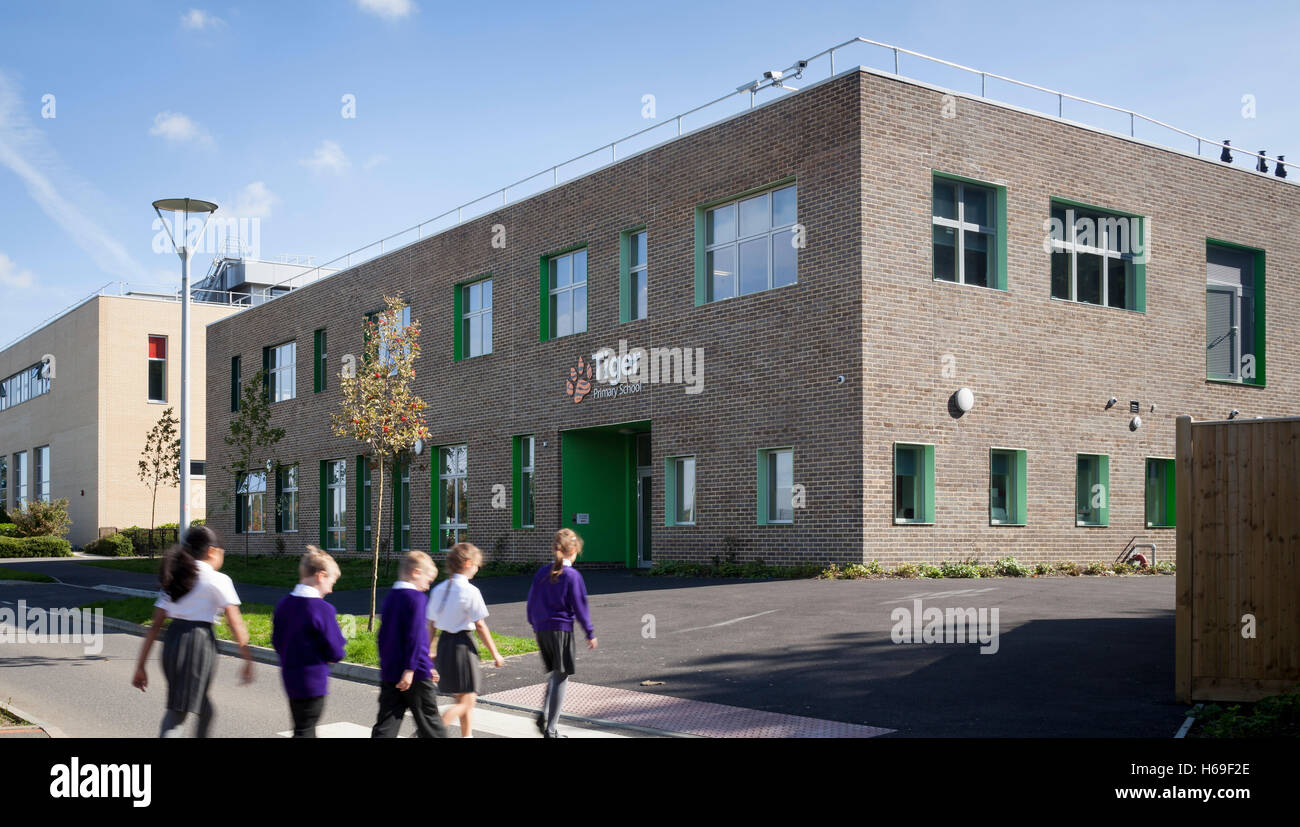Partial angled view of front with children walking to school. Tiger ...
