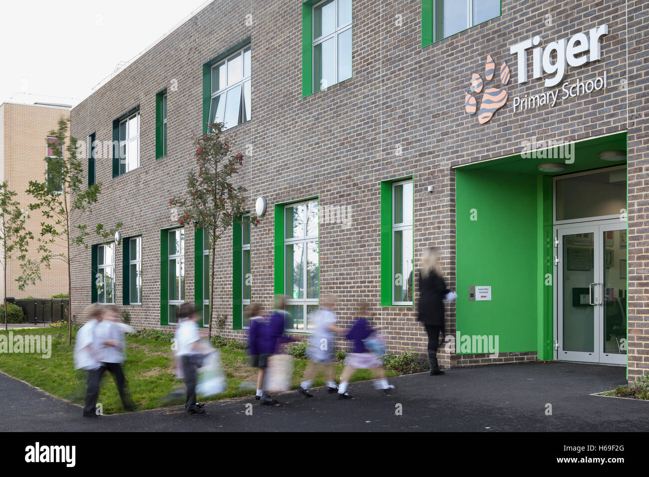 View on entrance with children walking to school. Tiger Primary School ...