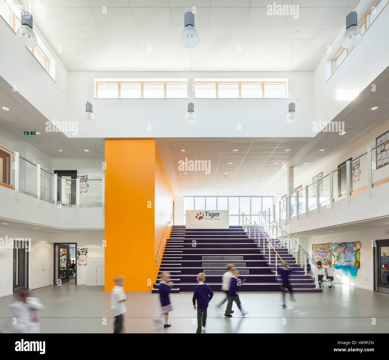 Square view of central atrium with children walking across. Tiger ...
