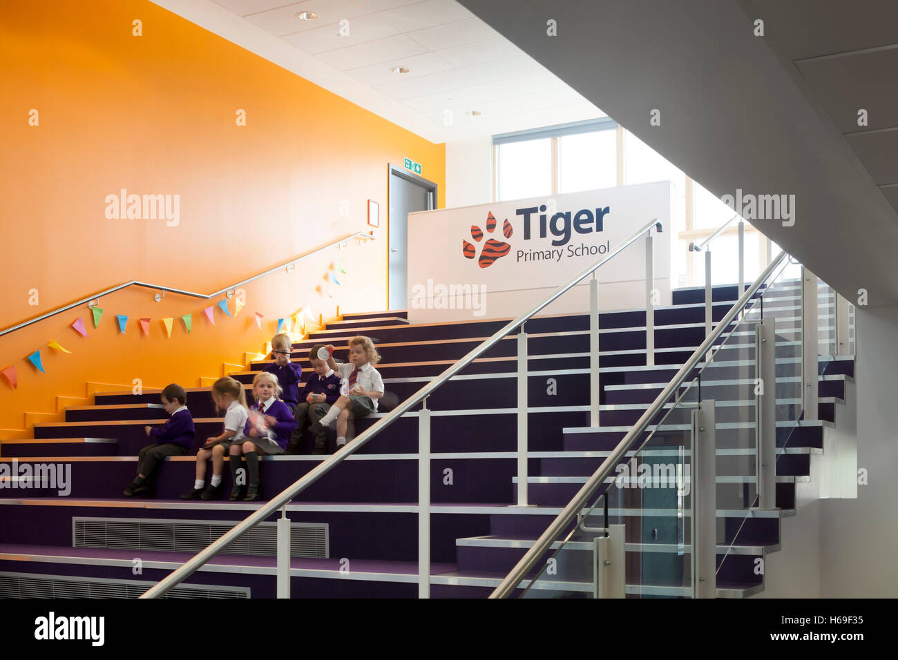Angled view of interior steps with pupils studying. Tiger Primary ...