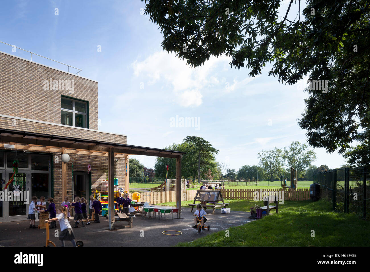 Angled view of exterior of classroom and play area. Tiger Primary ...