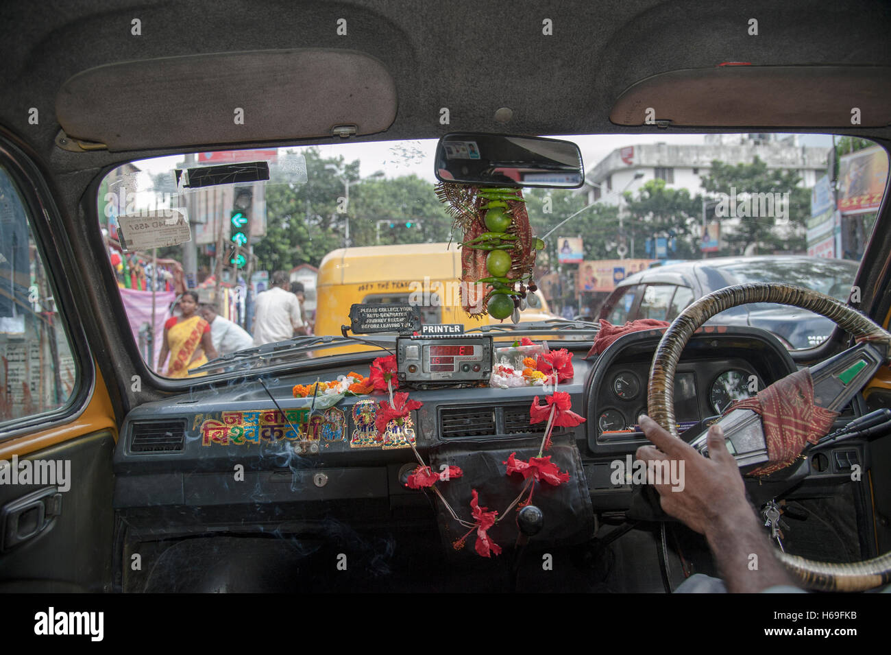 God photos and Limes and chilis (Hindu good luck charms) hang insid ...