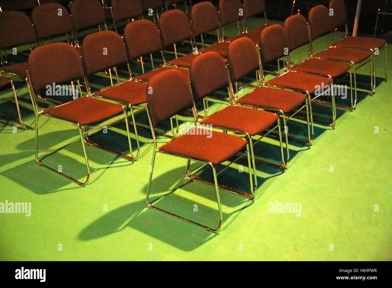 In rows of empty modern chairs in a conference room from above Stock ...