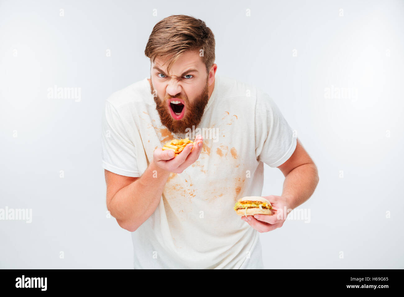 Man eating messy hamburger hi-res stock photography and images - Alamy