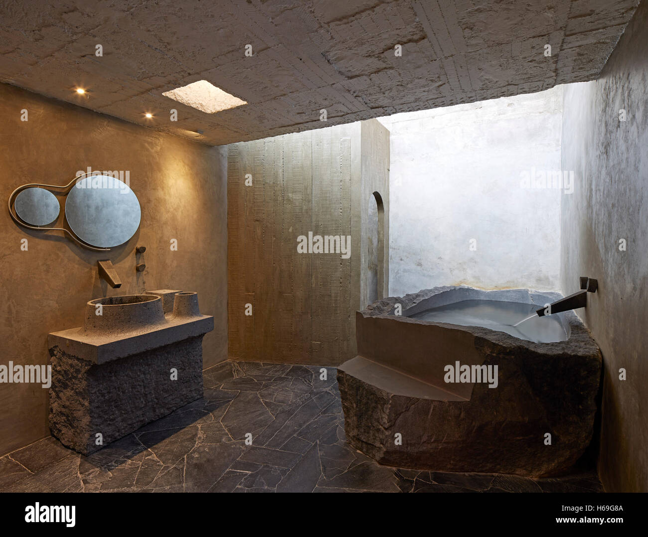 Main bathroom with carved bath and volcanic rock sink. Pedro Reyes ...