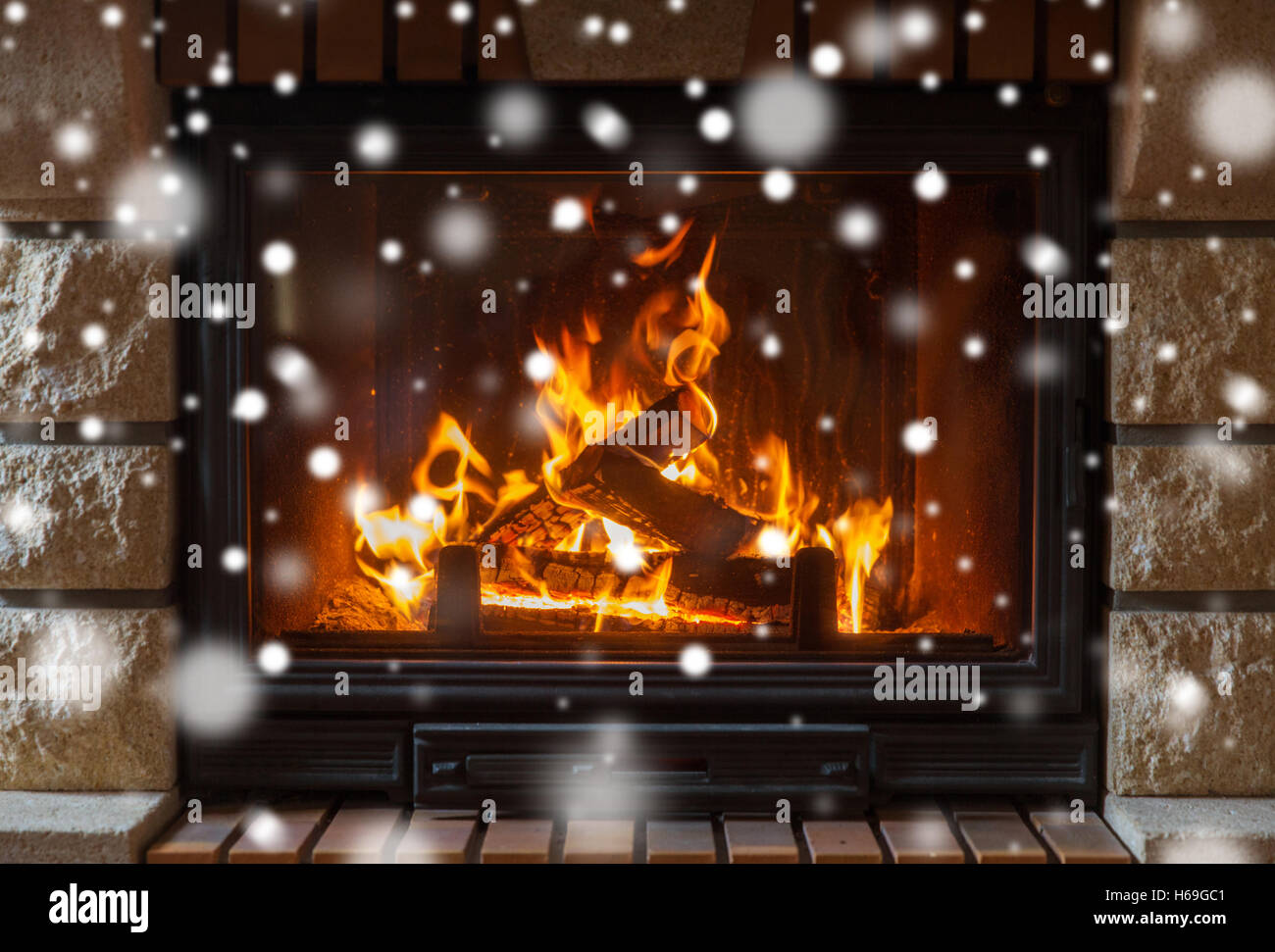 close up of burning fireplace with snow Stock Photo - Alamy