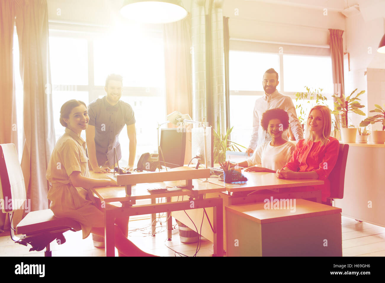 happy creative team in office Stock Photo - Alamy