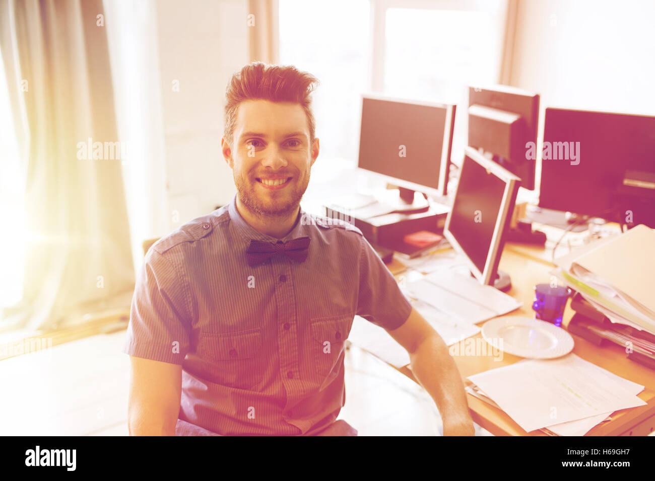 happy creative male office worker with computers Stock Photo - Alamy
