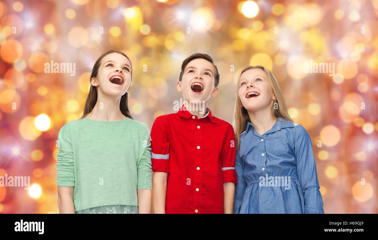amazed children looking up over holidays lights Stock Photo - Alamy