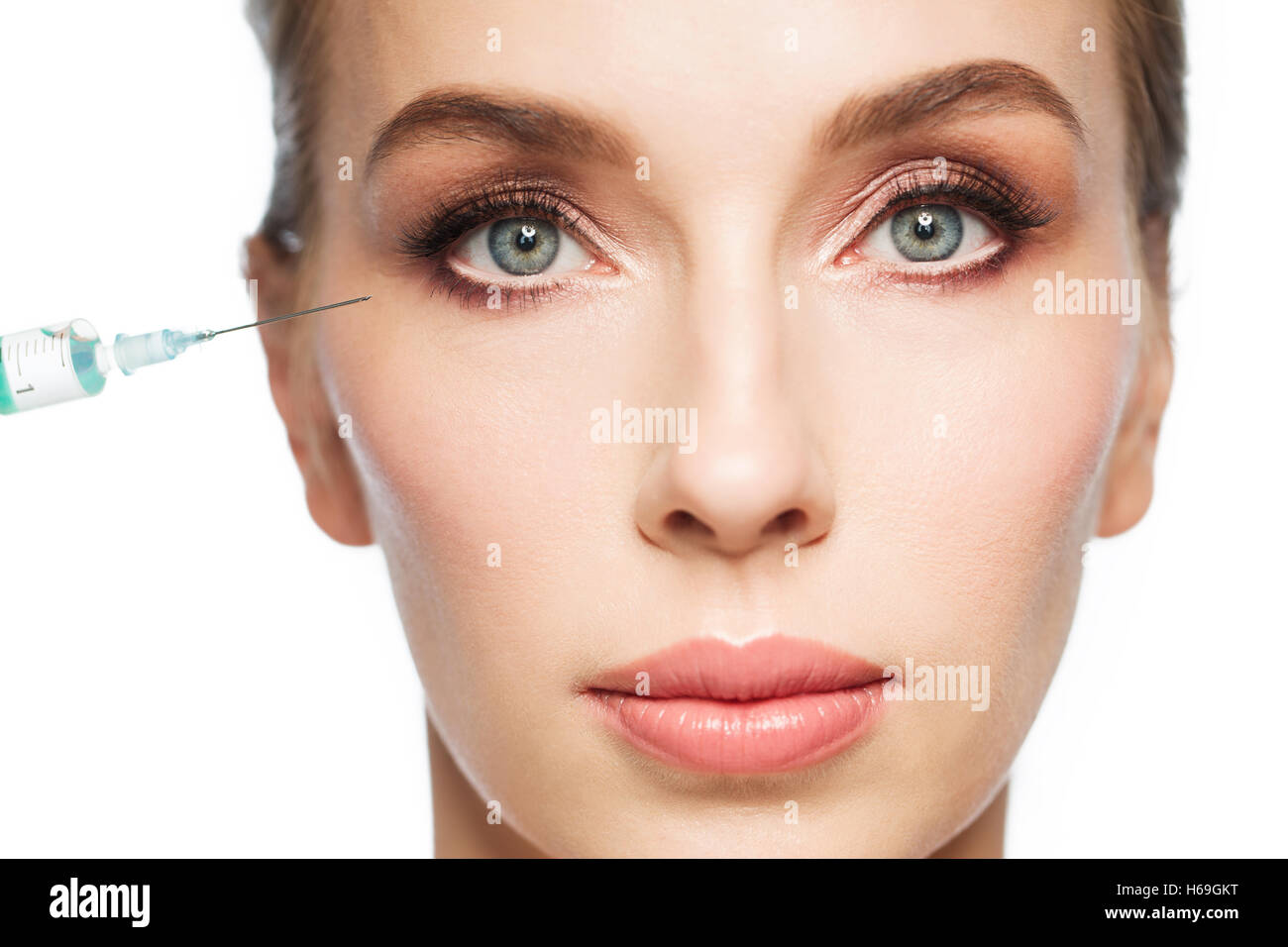 woman face and syringe making injection Stock Photo - Alamy