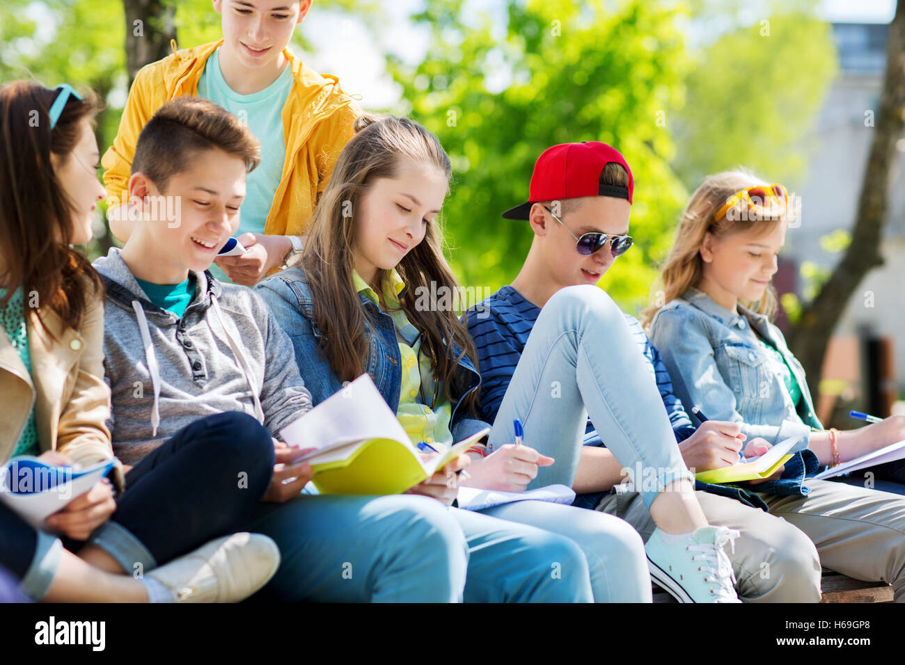 group of students with notebooks at school yard Stock Photo - Alamy