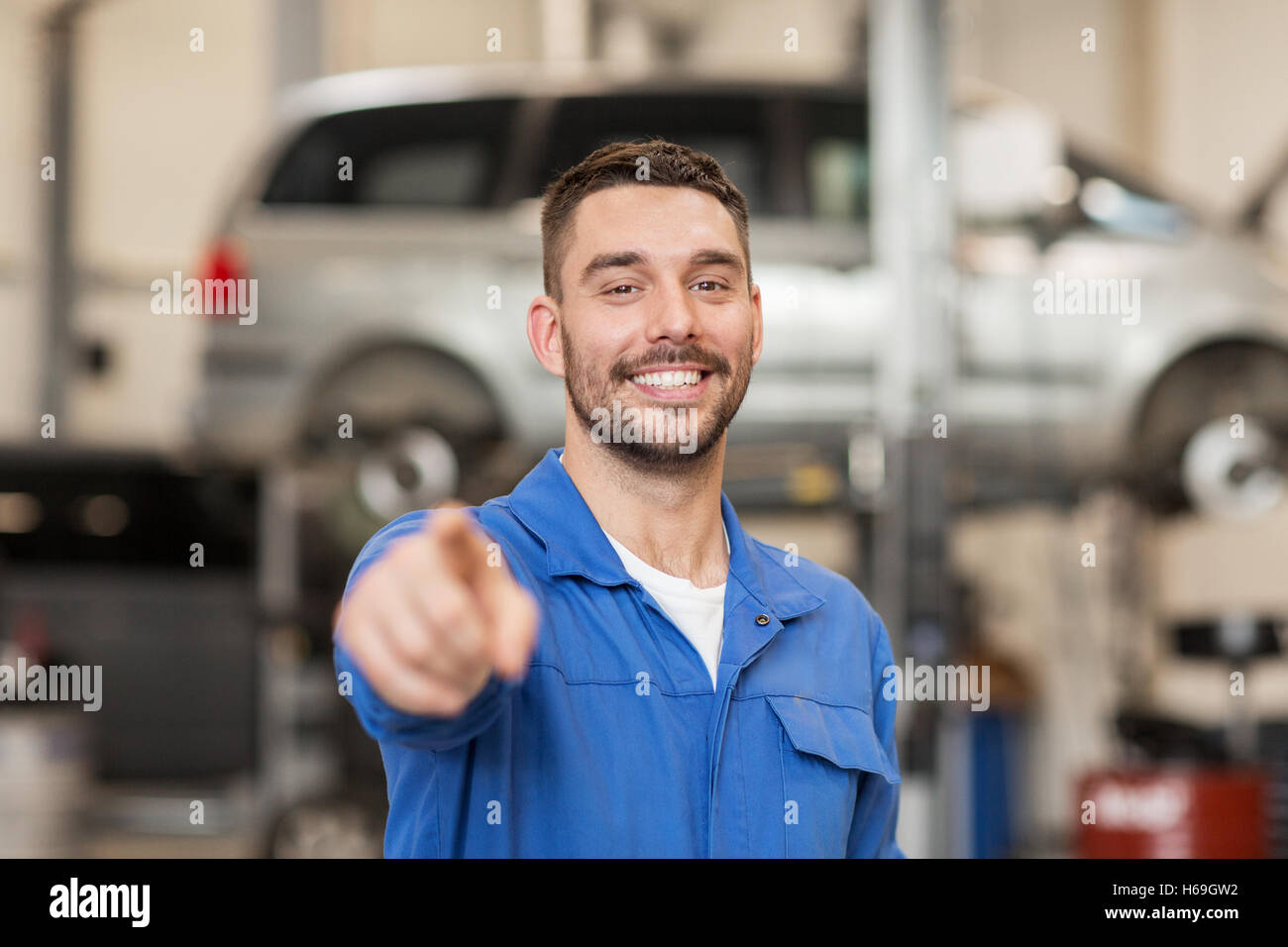 happy auto mechanic man or smith at car workshop Stock Photo - Alamy