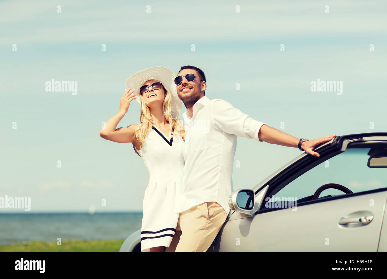 happy man and woman hugging near car at sea Stock Photo - Alamy