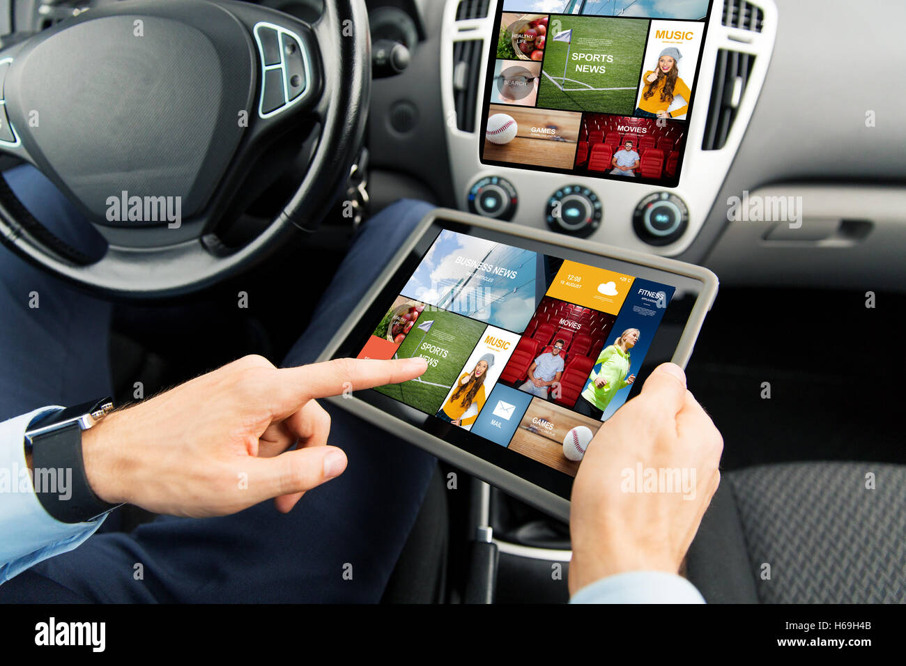 close up of man with tablet pc in car Stock Photo - Alamy