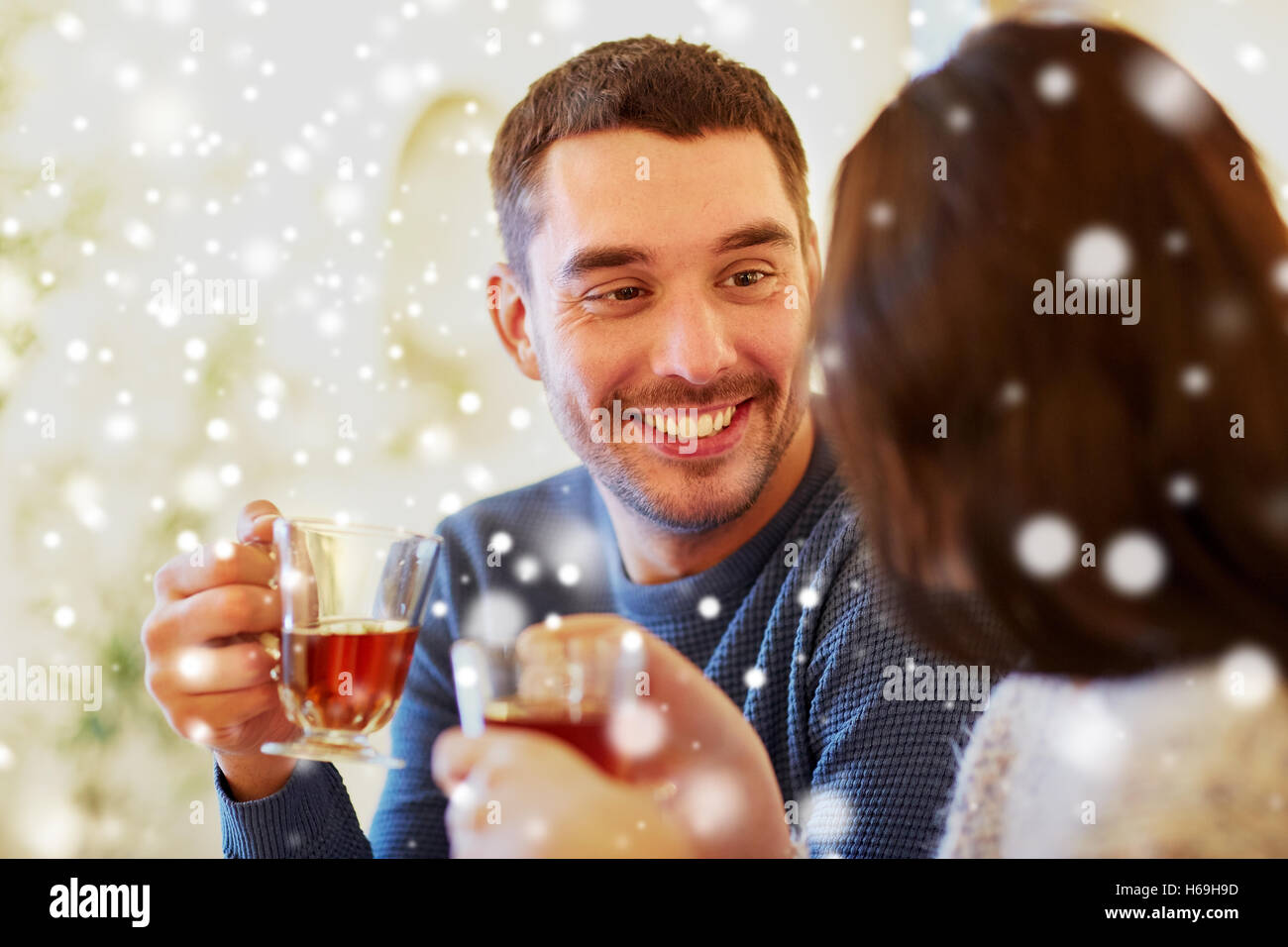 happy couple drinking tea at cafe Stock Photo - Alamy