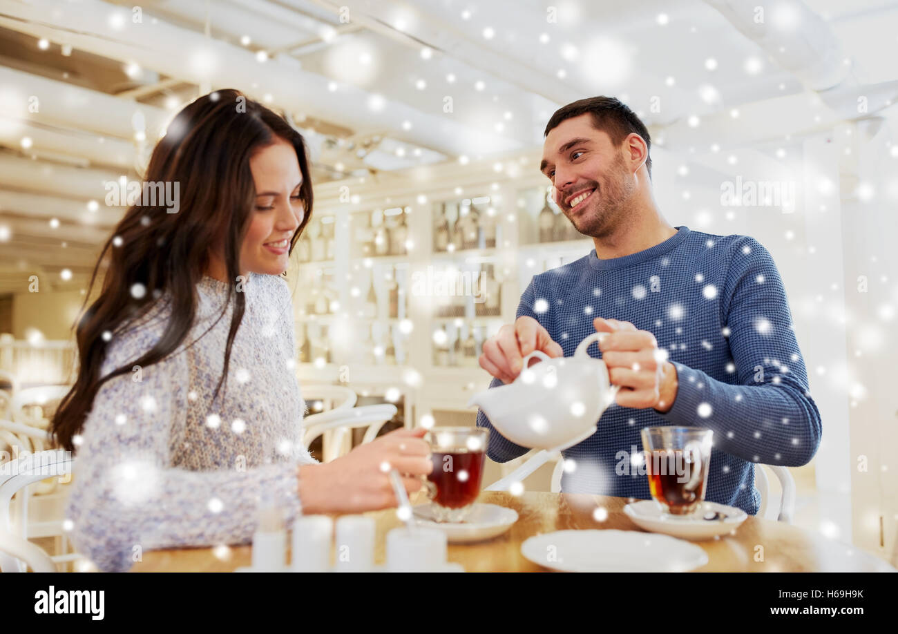 happy couple drinking tea at cafe Stock Photo - Alamy