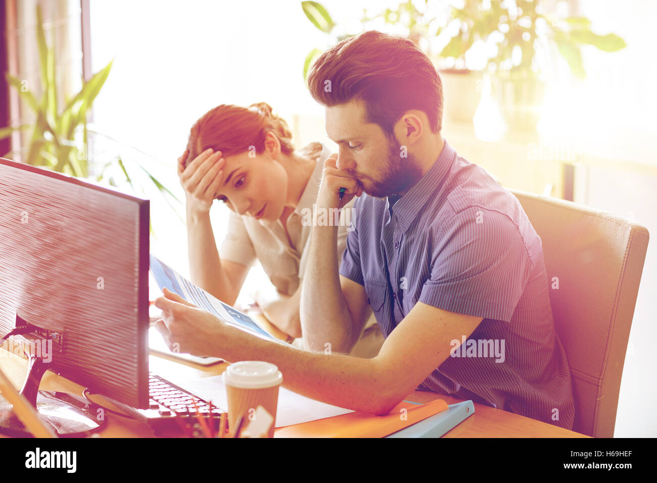 business team with computer and files in office Stock Photo - Alamy